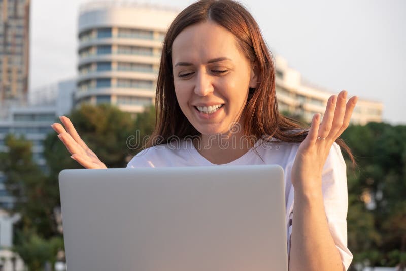 Young Cheerful Woman Smiling while Talking by Video Call or Video Chat ...