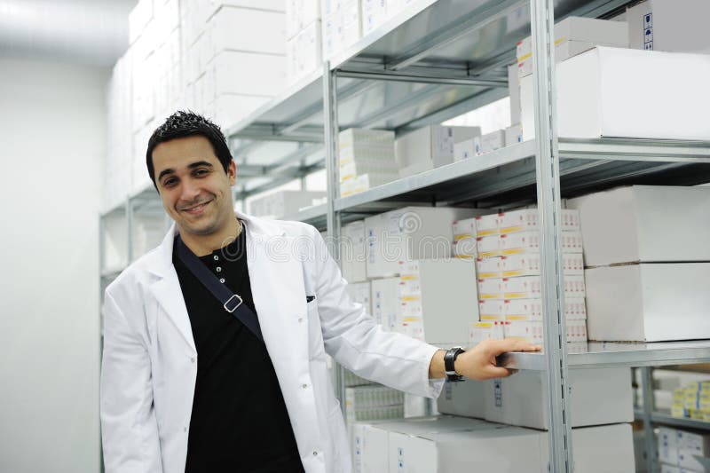 Young cheerful worker stock photo. Image of shelf, manager - 23006456