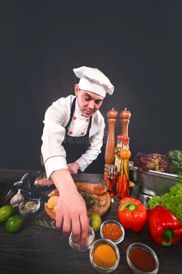 Young Chef Cooking in a Cuisine. Vertical Stock Image - Image of ...