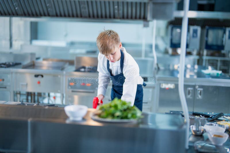 Young Chef Cooking at Restaurant Kitchen Stock Photo - Image of kitchen ...