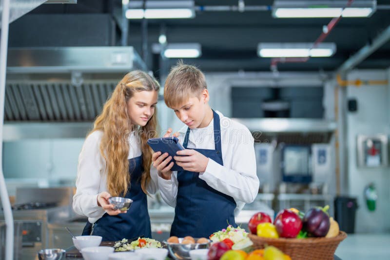 Young Chef Cooking at Restaurant Kitchen Stock Photo - Image of ...