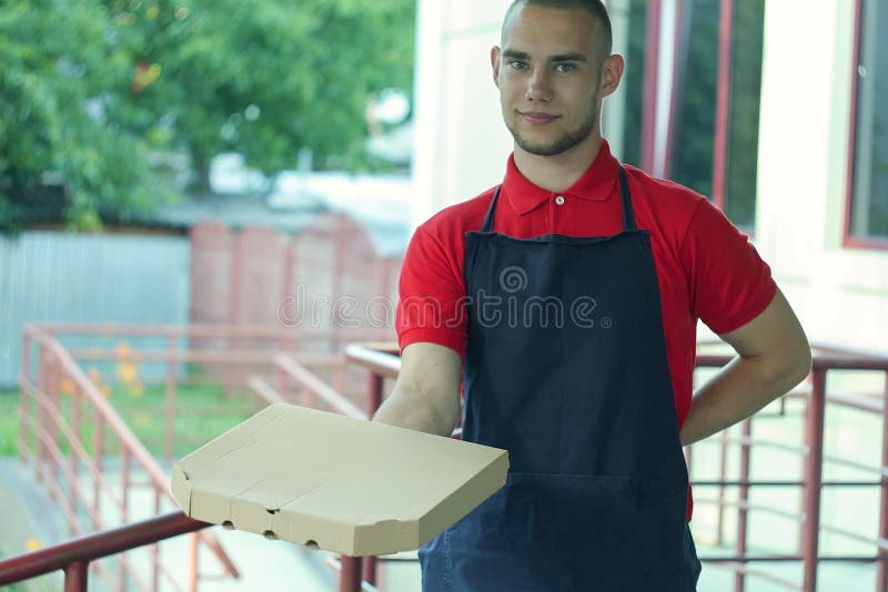 Young Chef Holding Pizza in the Street Stock Photo - Image of hold ...