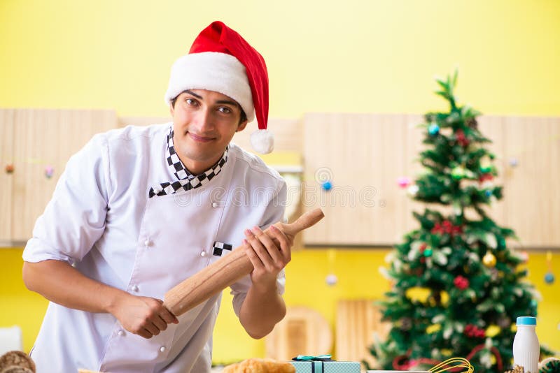 The Young Chef Husband Working in Kitchen at Christmas Eve Stock Photo ...