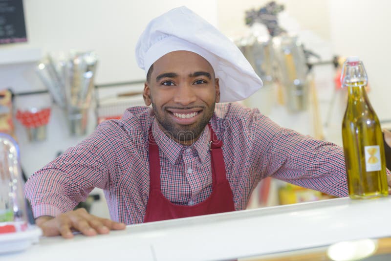 Young Chef Leaning on Kitchen Counter Stock Photo - Image of background ...