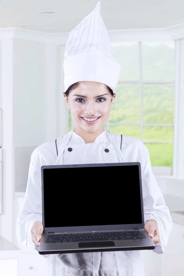 Young Chef Showing Laptop in Kitchen Stock Photo - Image of internet ...