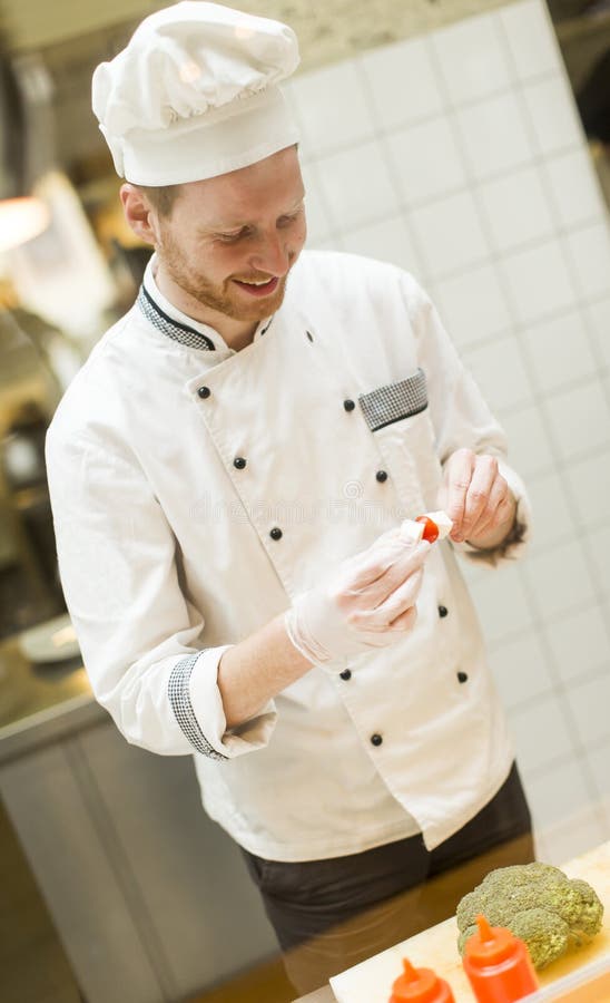 Young Chef Standing in a Modern Kitchen in the Restaurant and Pr Stock ...