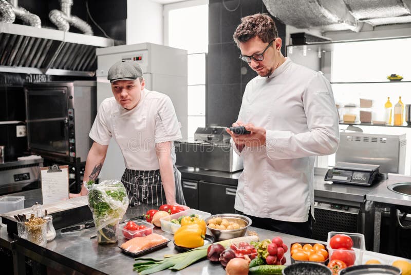 Chef Checking List of Vegetables before Cooking Stock Image - Image of ...