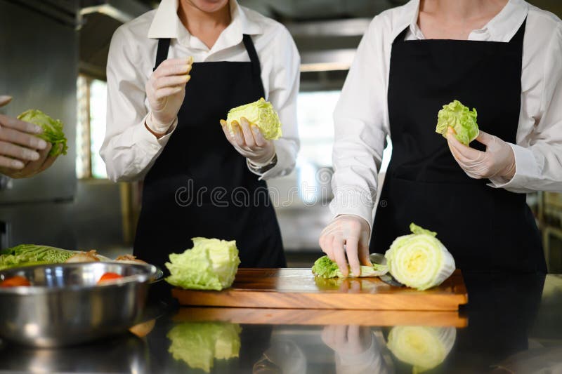 Young Chefs Practice Slicing Vegetables during a Hands on Cooking Class ...
