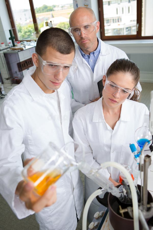 Young Chemist Doing Experiment Stock Image - Image of fluid, education ...