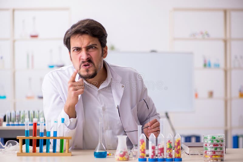 Young Male Chemist in Drugs Synthesis Concept Stock Image - Image of ...