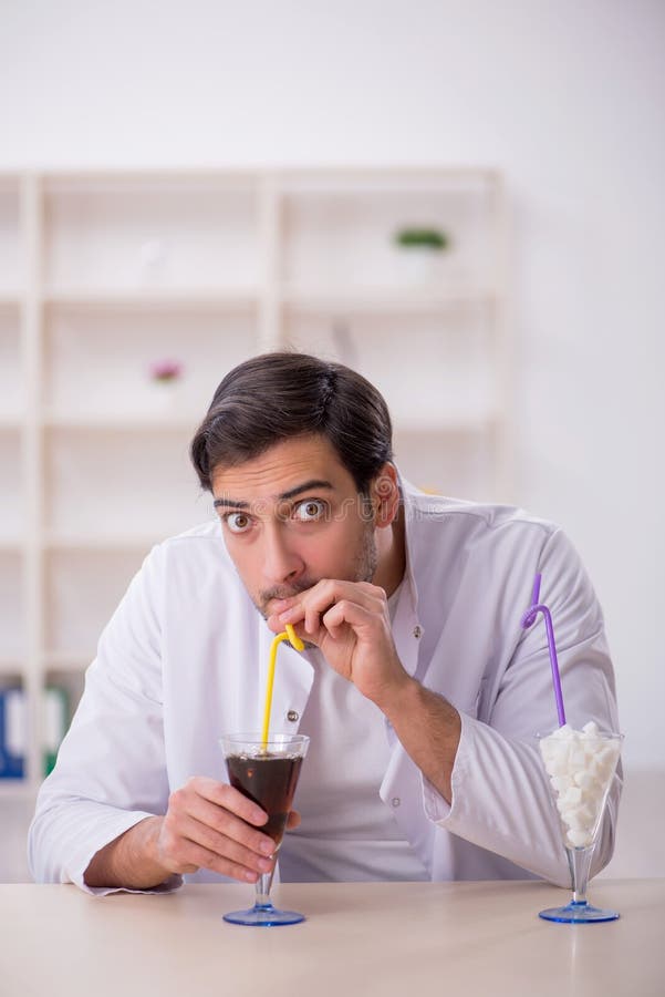 Young Male Chemist Examining Soft Drink at the Lab Stock Image - Image ...