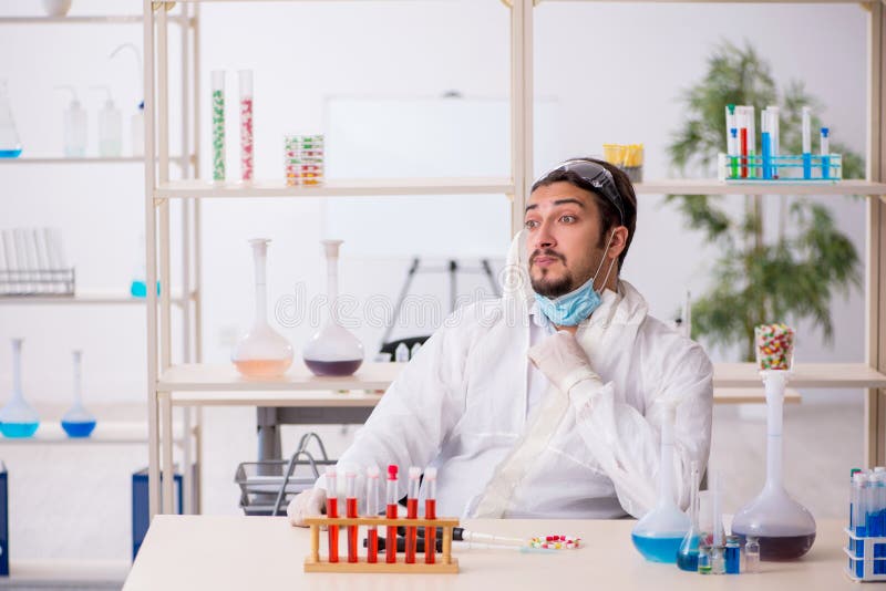 Young Male Chemist Extremely Tired at the Lab Stock Photo - Image of ...