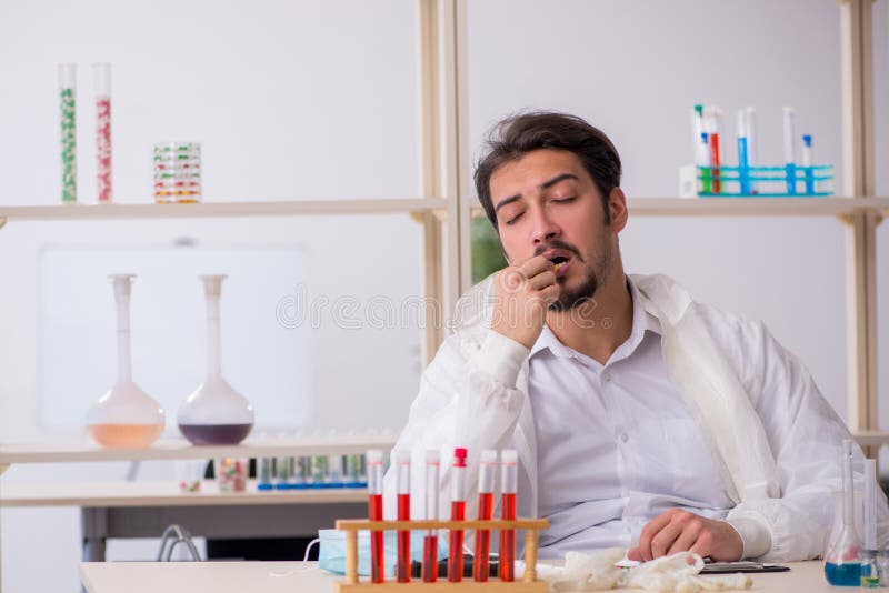 Young Male Chemist Extremely Tired at the Lab Stock Photo - Image of ...