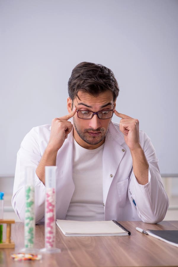 Young Male Chemist in Front of White Board Stock Photo - Image of ...