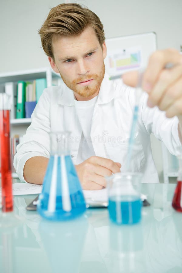 Young Chemist Makes Chemical Test Stock Photo - Image of bottle ...