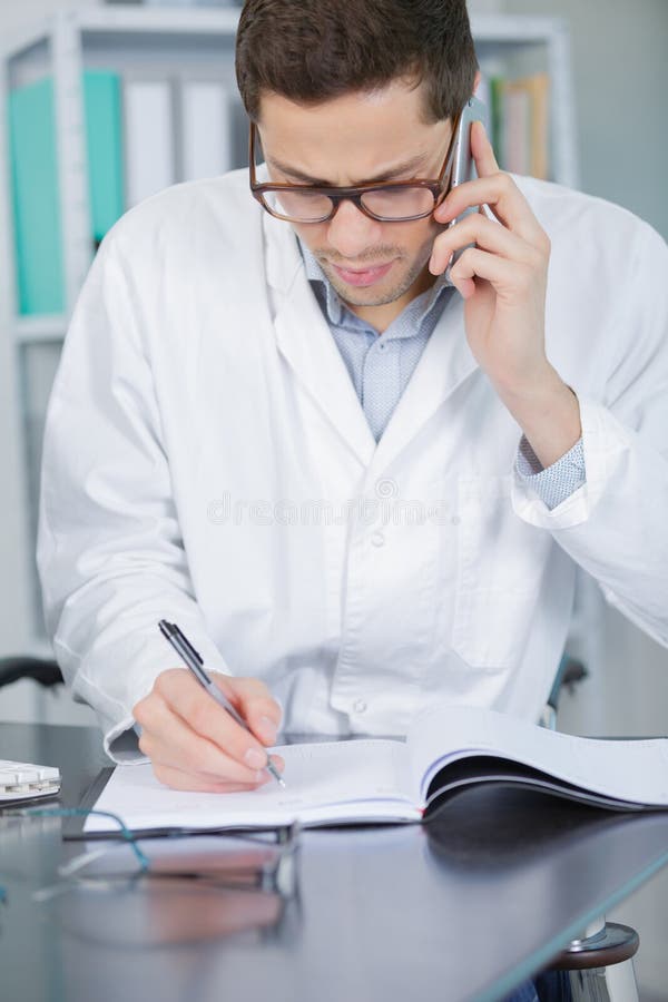 Young Chemist on Phone in Lab Stock Photo - Image of technology ...