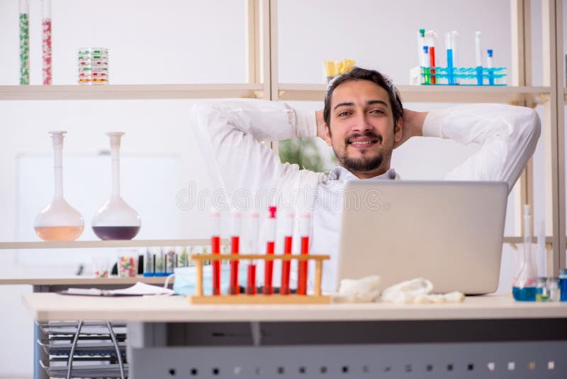 Young Male Chemist Sitting at Computer at the Lab Stock Photo - Image ...