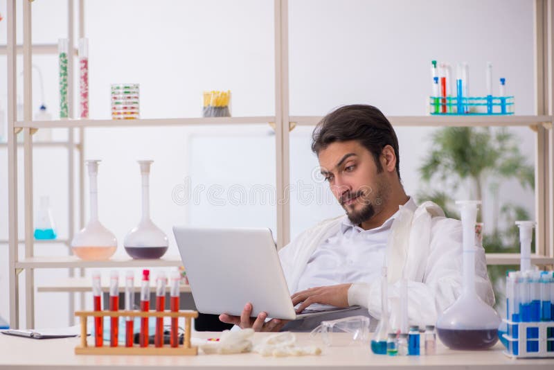 Young Male Chemist Sitting at Computer at the Lab Stock Image - Image ...
