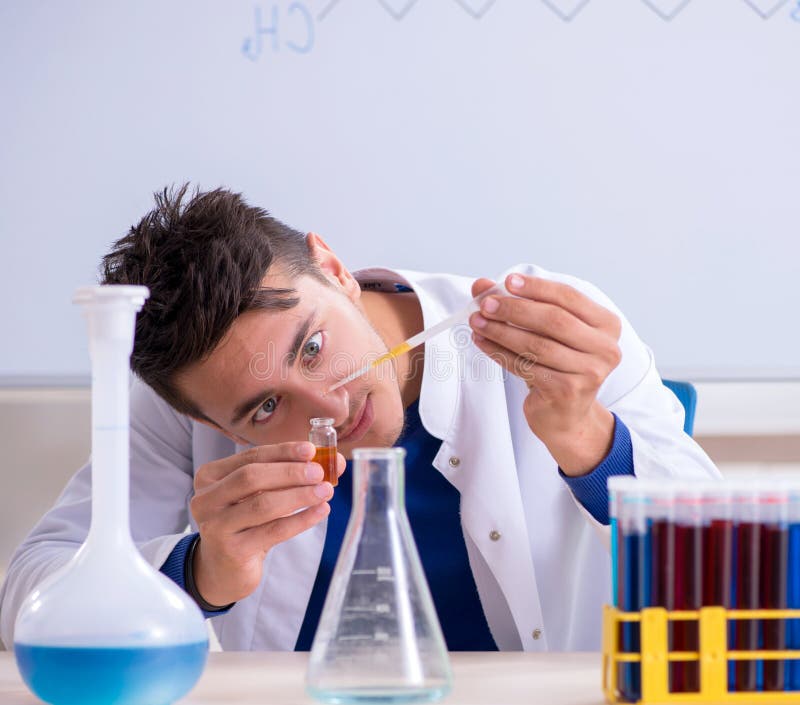 The Young Chemist Sitting in the Lab Stock Photo - Image of biology ...