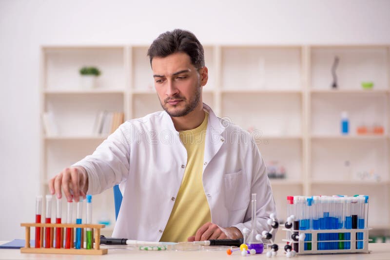 Young Male Chemist Sitting at the Lab Stock Image - Image of medicine ...