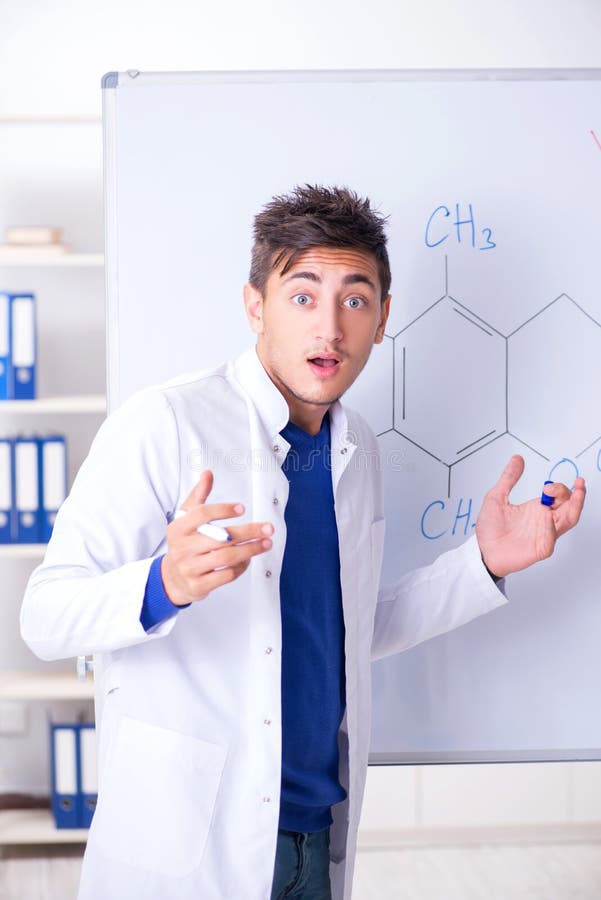 The Young Chemist Standing in Front of the Whiteboard Stock Image ...