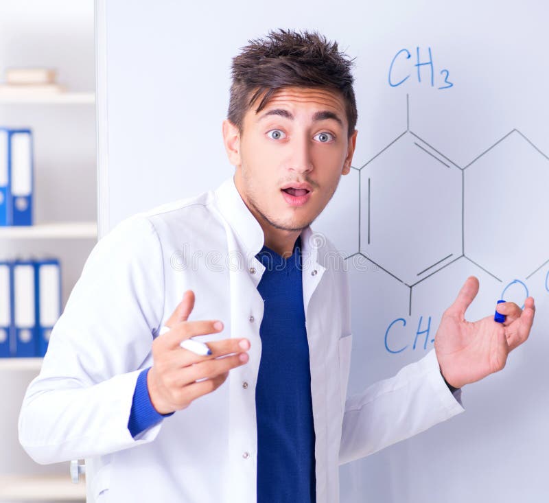 Young Chemist Standing in Front of the Whiteboard Stock Image - Image ...
