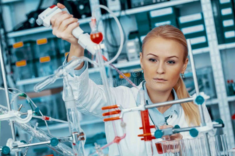 Young Chemist Working in a Crowded Laboratory with Technology Stock ...