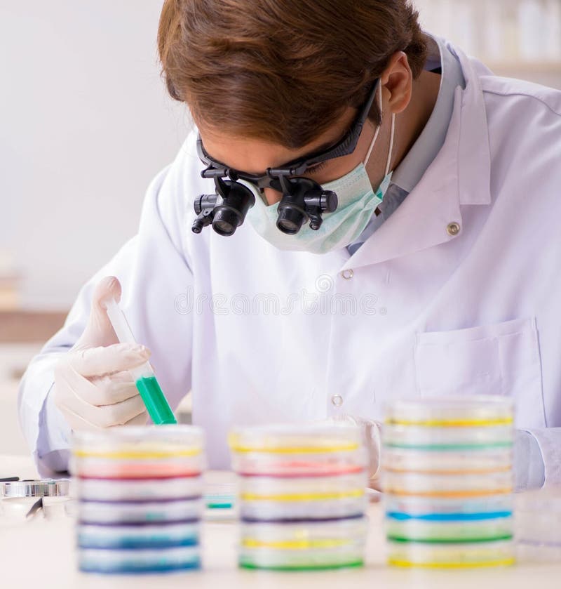 Young Chemist Working in the Lab Stock Photo - Image of mask, liquid ...