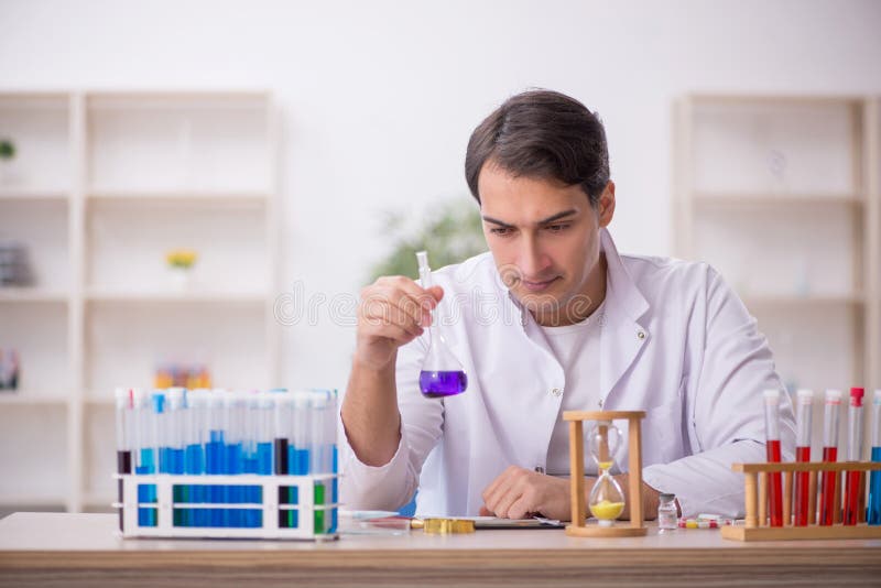 Young Male Chemist Working at the Lab Stock Photo - Image of ...