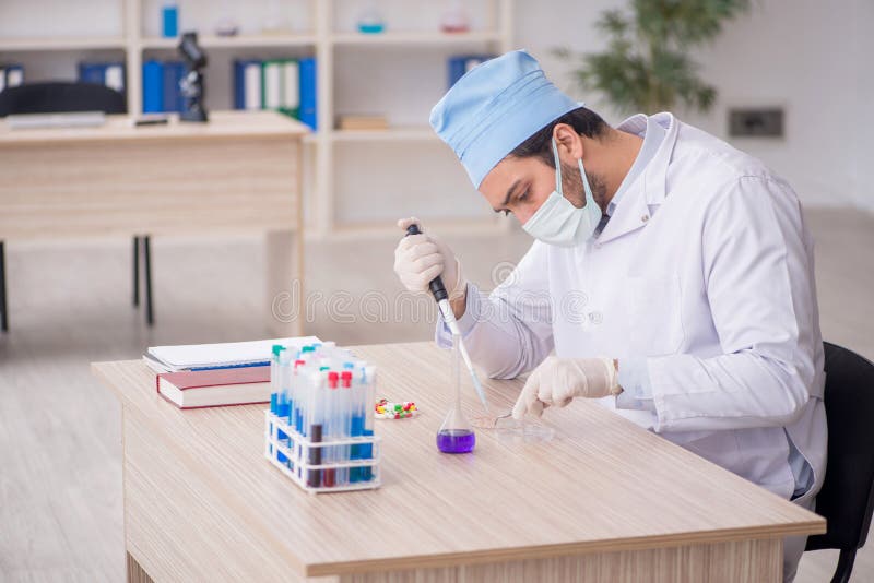 Young Male Chemist Working at the Lab Stock Photo - Image of vitamins ...