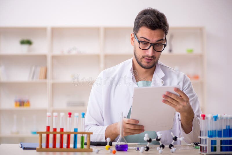 Young Male Chemist Sitting at the Lab Stock Image - Image of ...
