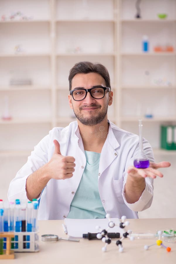 Young Male Chemist Sitting at the Lab Stock Image - Image of tubing ...