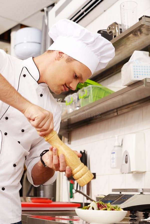 Young Chief in Apron Preparing To Cook Steak on BBQ Grill. Side View of ...