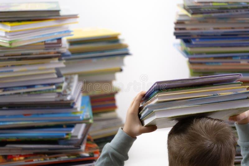 A Young Child Balances a Stack of Colorful Books on Their Head ...