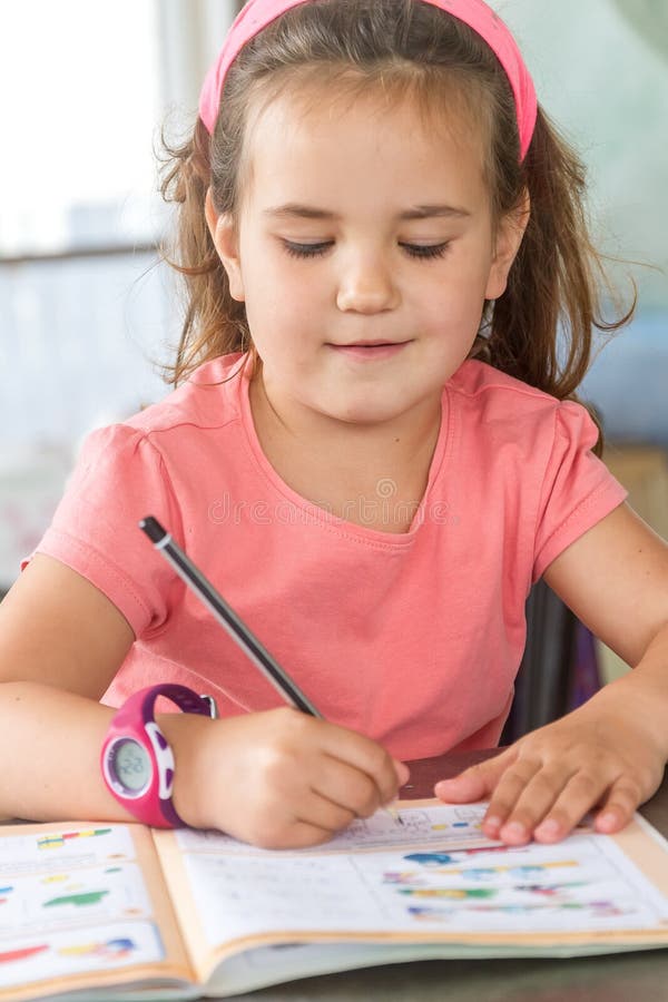 Young Child Girl Writing in Notebook Stock Image - Image of caucasian ...