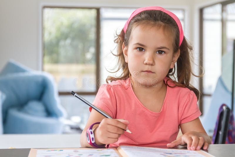 Young Child Girl Writing in Notebook Stock Image - Image of beautiful ...