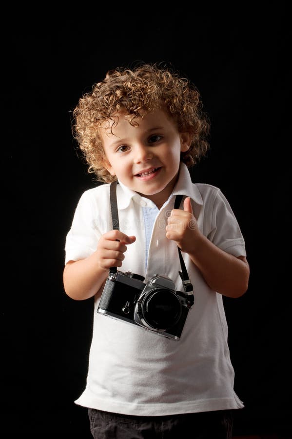 Young Child Holding a Camera Stock Image - Image of face, photographer ...