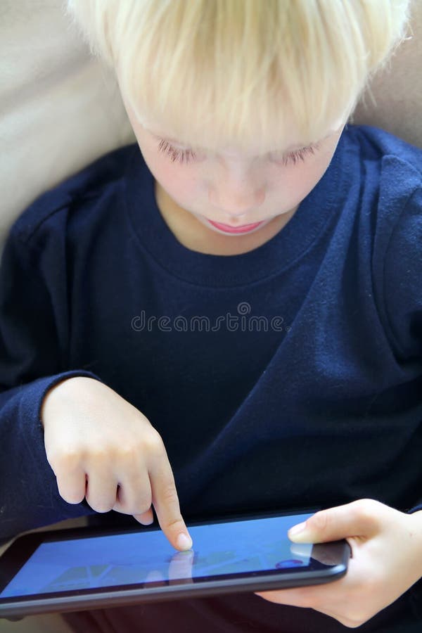 Young Child Playing Internet Game on Computer Tablet Stock Image ...