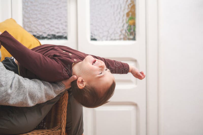 A Young Child is Playing with a Mother, and the Child is Smiling. Stock ...