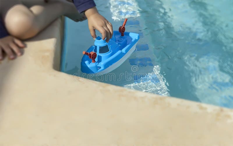 Young Child Playing with Toy Boat. Stock Image - Image of beach ...