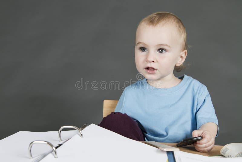 Young child at small desk stock image. Image of background - 26245261