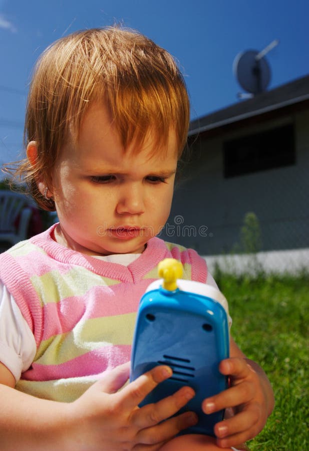 Young child with toy phone stock image. Image of mobile - 6936903