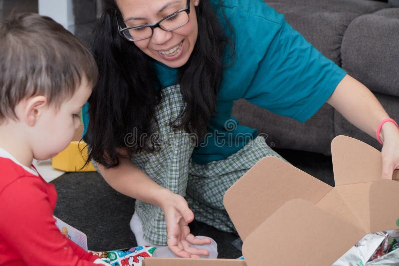 Young Children Opening Christmas Presents at Home Stock Image - Image ...