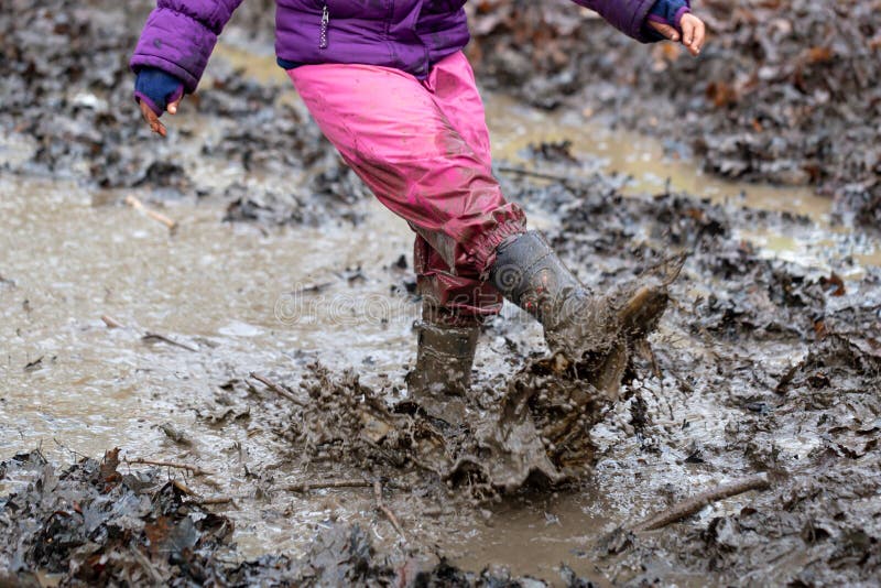 Young Children Playing in a Mud Puddle Stock Photo - Image of fall ...