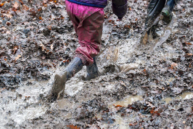 Young Children Playing in a Mud Puddle Stock Photo - Image of outside ...