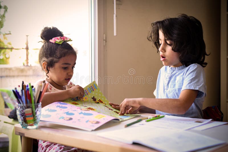 Young Children Working at Home Stock Image - Image of children ...