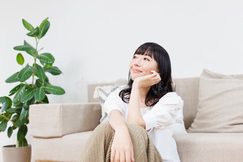 Young chilling at home stock image. Image of relax, asian - 299913339