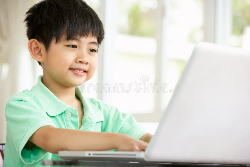 Young Chinese Boy Using Laptop at Home Stock Image - Image of laptop ...