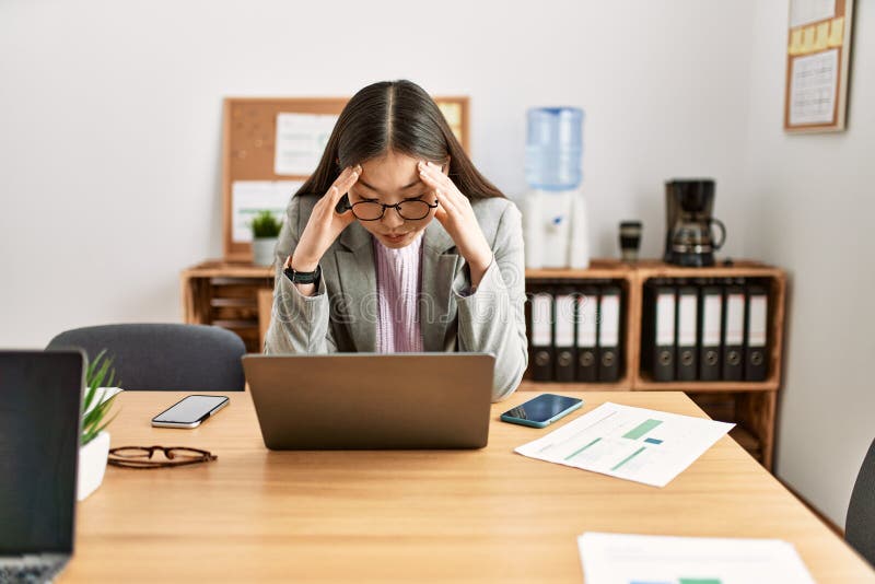 Young Chinese Businesswoman Stressed Working at the Office Stock Photo ...