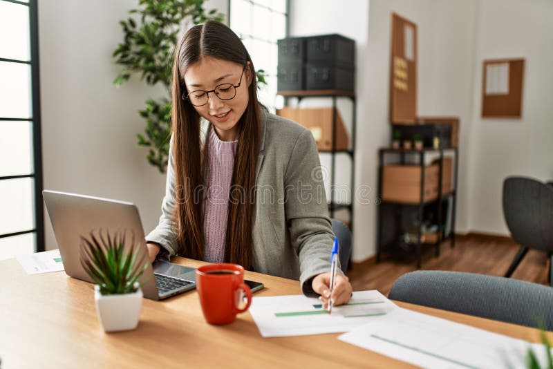 Young Chinese Businesswoman Using Laptop Working at the Office Stock ...